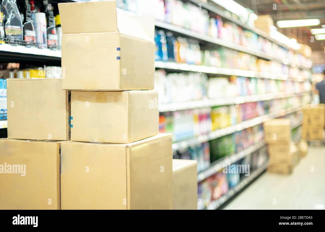 Empty carton in the stainless trolley at Supermarket aisle preparing ...