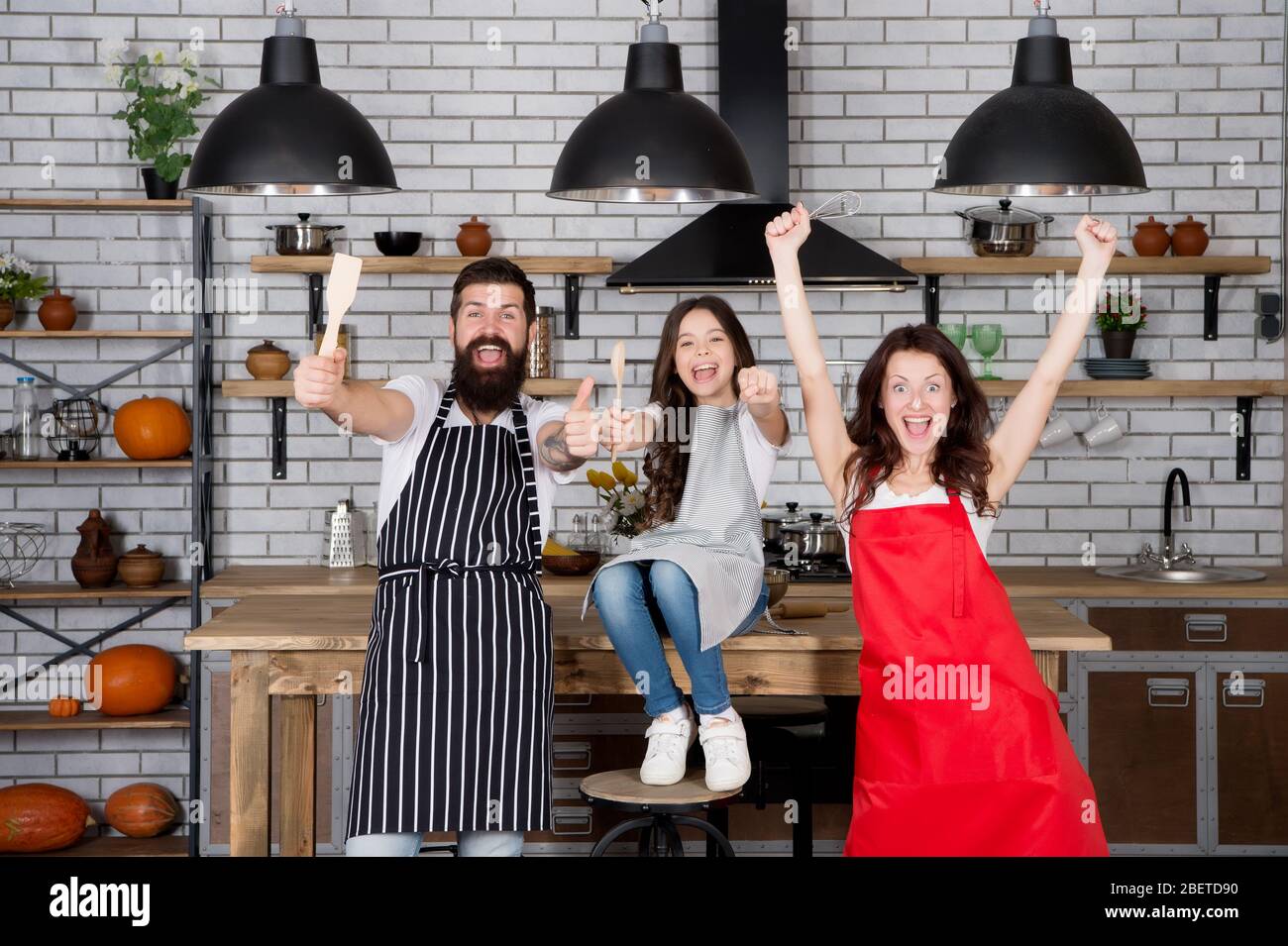 Nothing but family. relatives having fun while cooking. Mother and ...