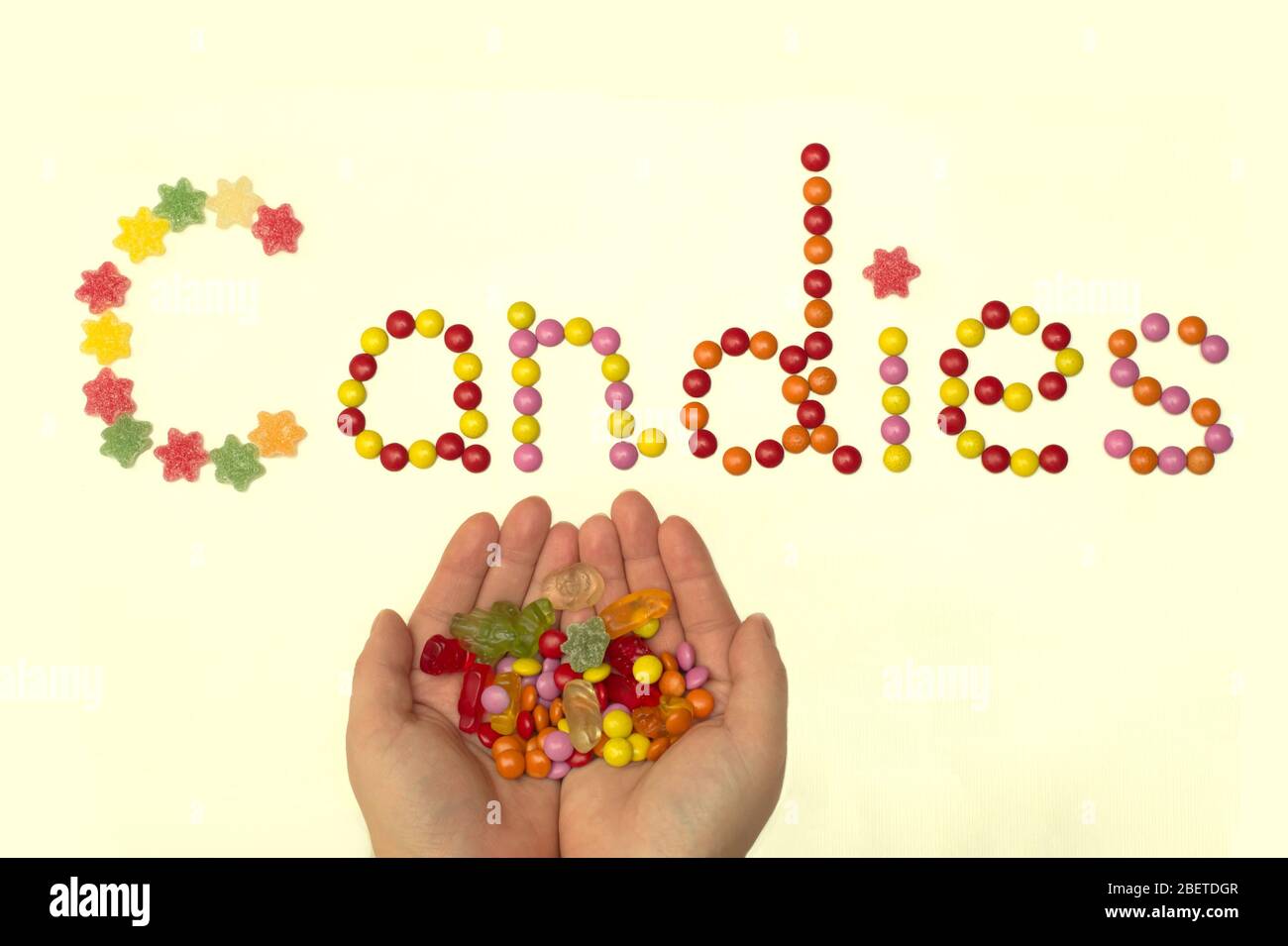 A word Candies lined with colorful candies on a light background Stock ...
