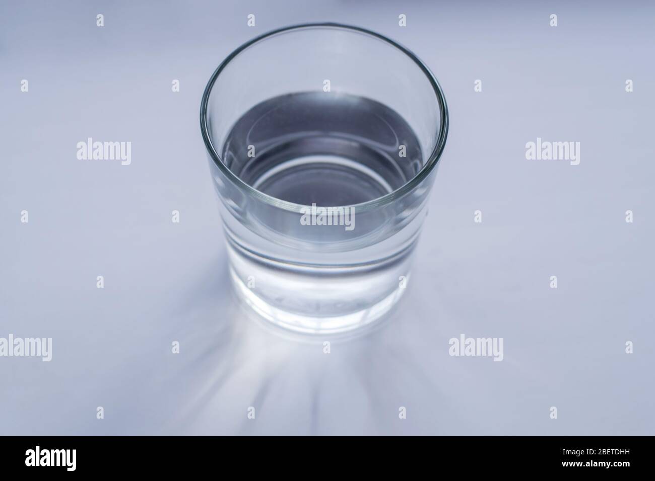 A glass of pure water on a light background Stock Photo - Alamy