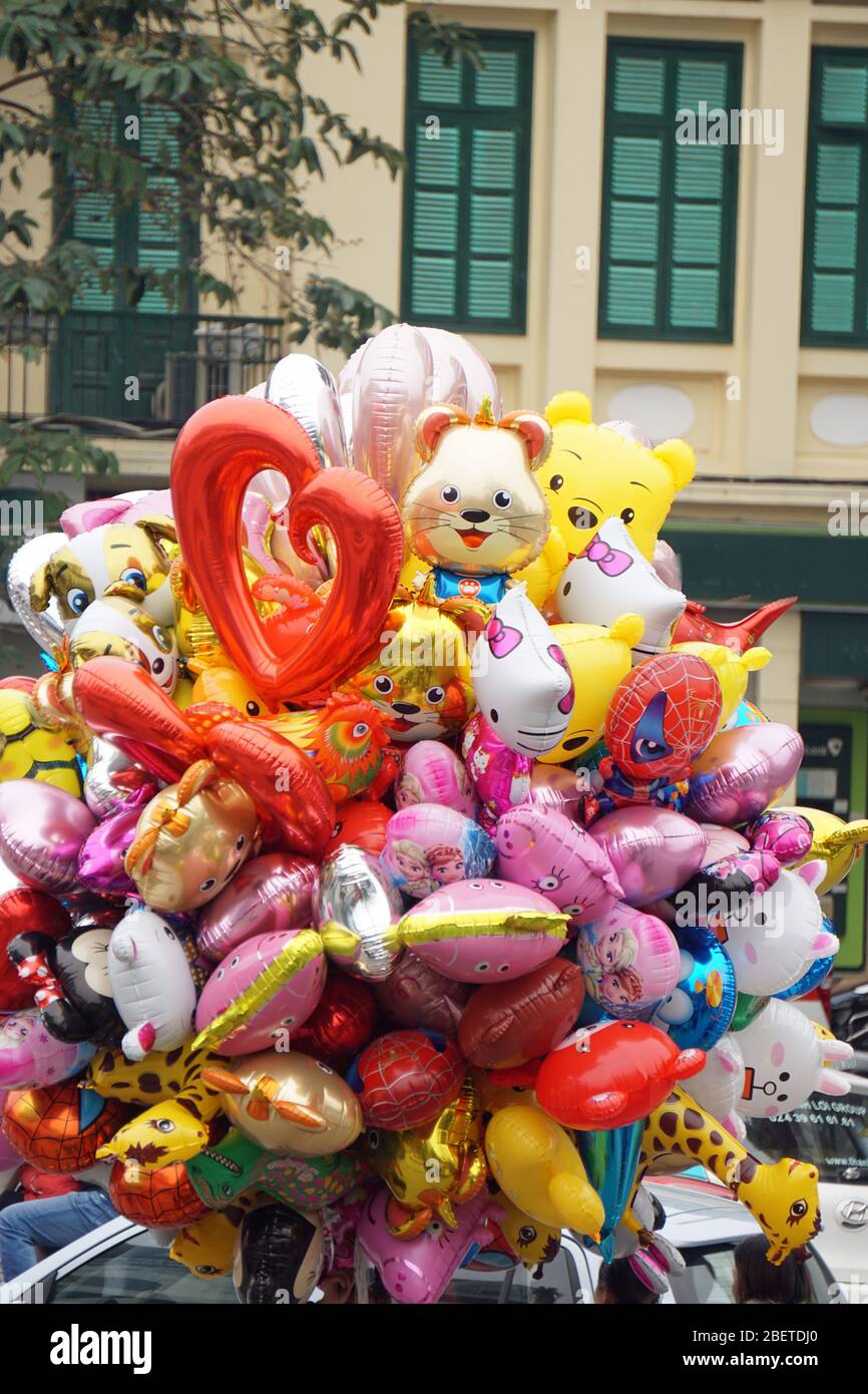 merchant selling colorful balloons in the streets of hanoi Stock Photo ...