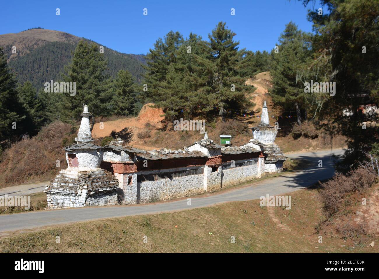 A Buddhist prayer wall (mendong) and chorten or stupa near the Gangtey ...
