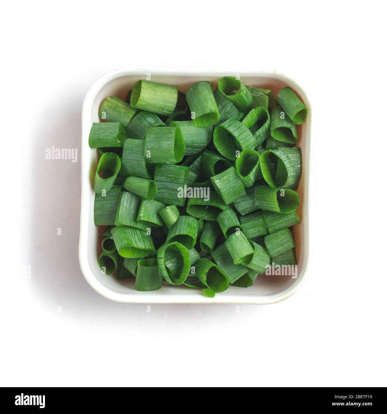 Chopped Spring Onions isolated on white background Stock Photo - Alamy