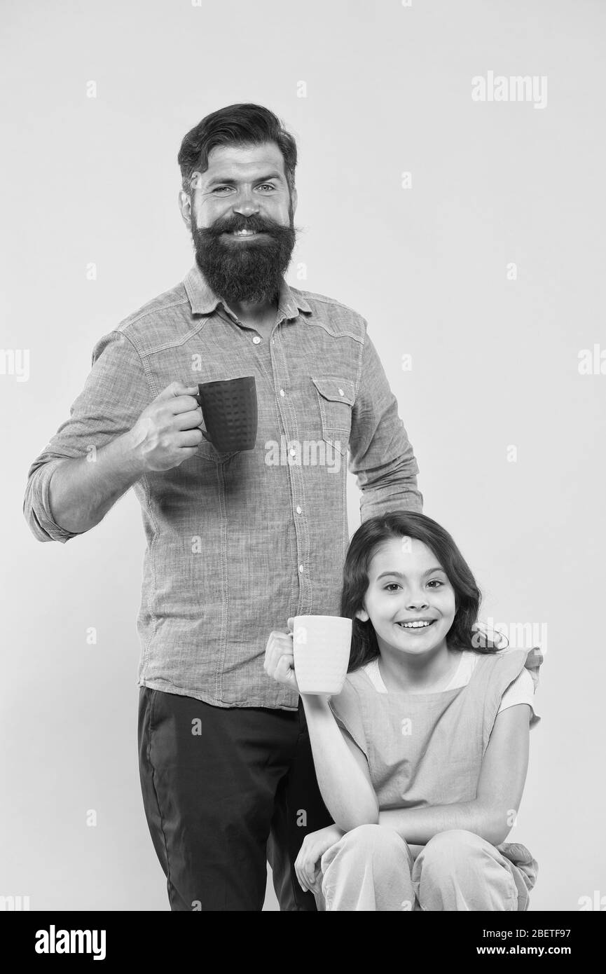 Father and daughter drink tea at home. Tea party concept. Good morning ...