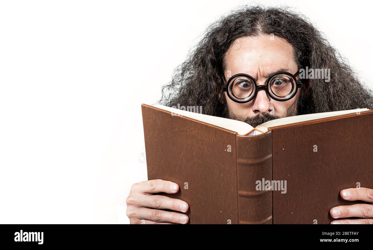 Eccentric, young nerd reading a novel Stock Photo - Alamy
