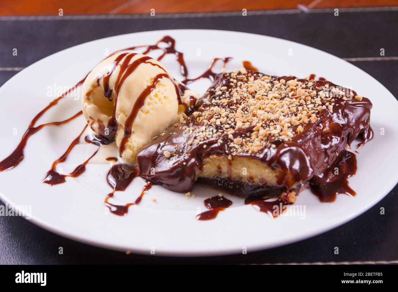 Chocolate Crepe with nuts and Ice cream Stock Photo - Alamy