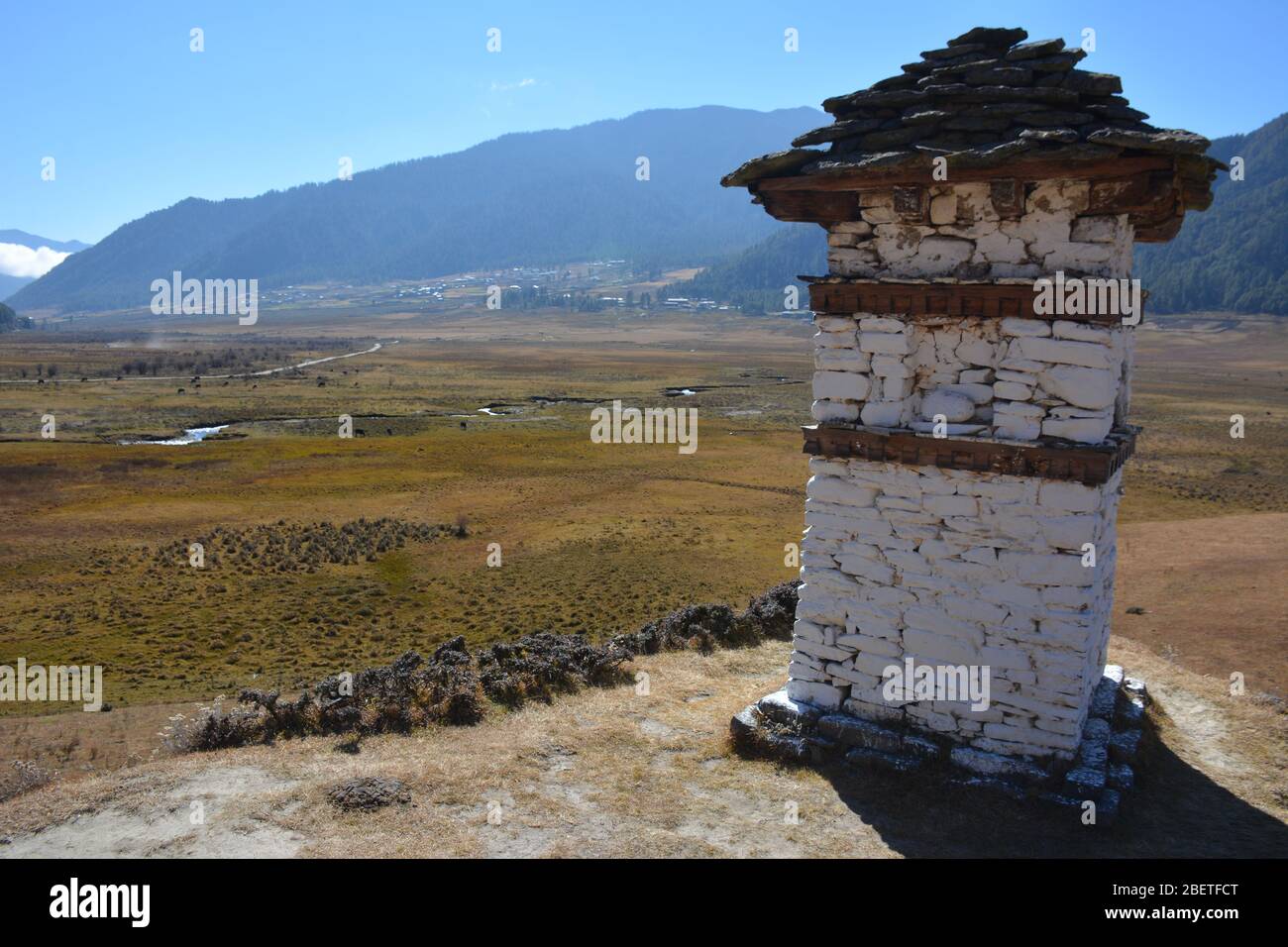 Buddhist stupa amid the landscape of the Phobjikha Valley, Bhutan Stock ...