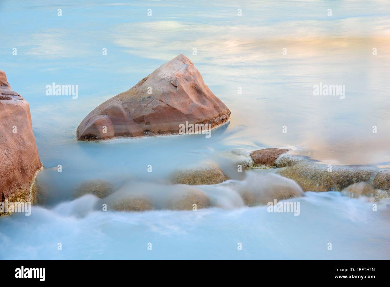 Little Colorado River- mineral-laden water flowing over travertine ...