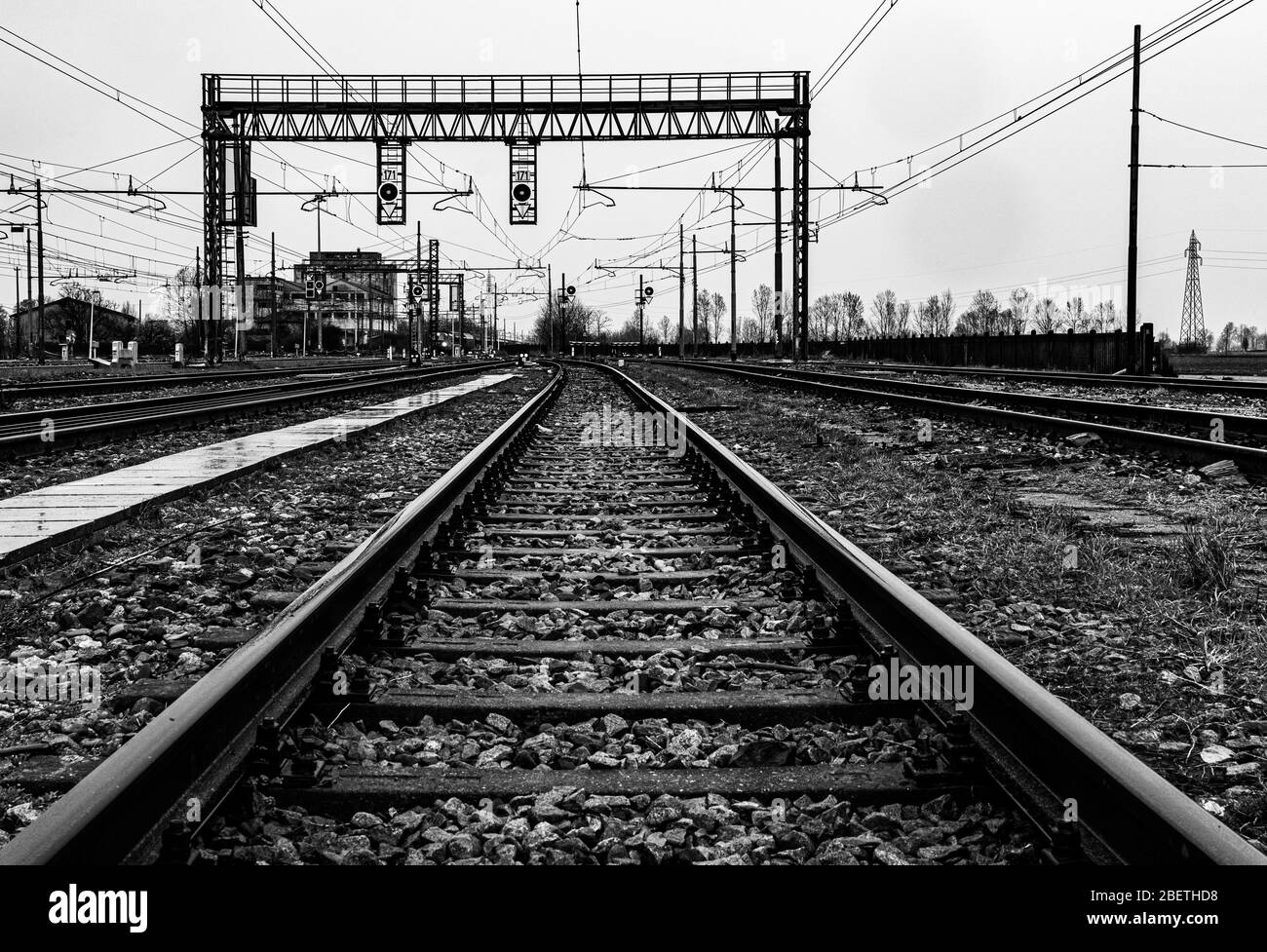 Empty railroad tracks on a rainy day Stock Photo - Alamy
