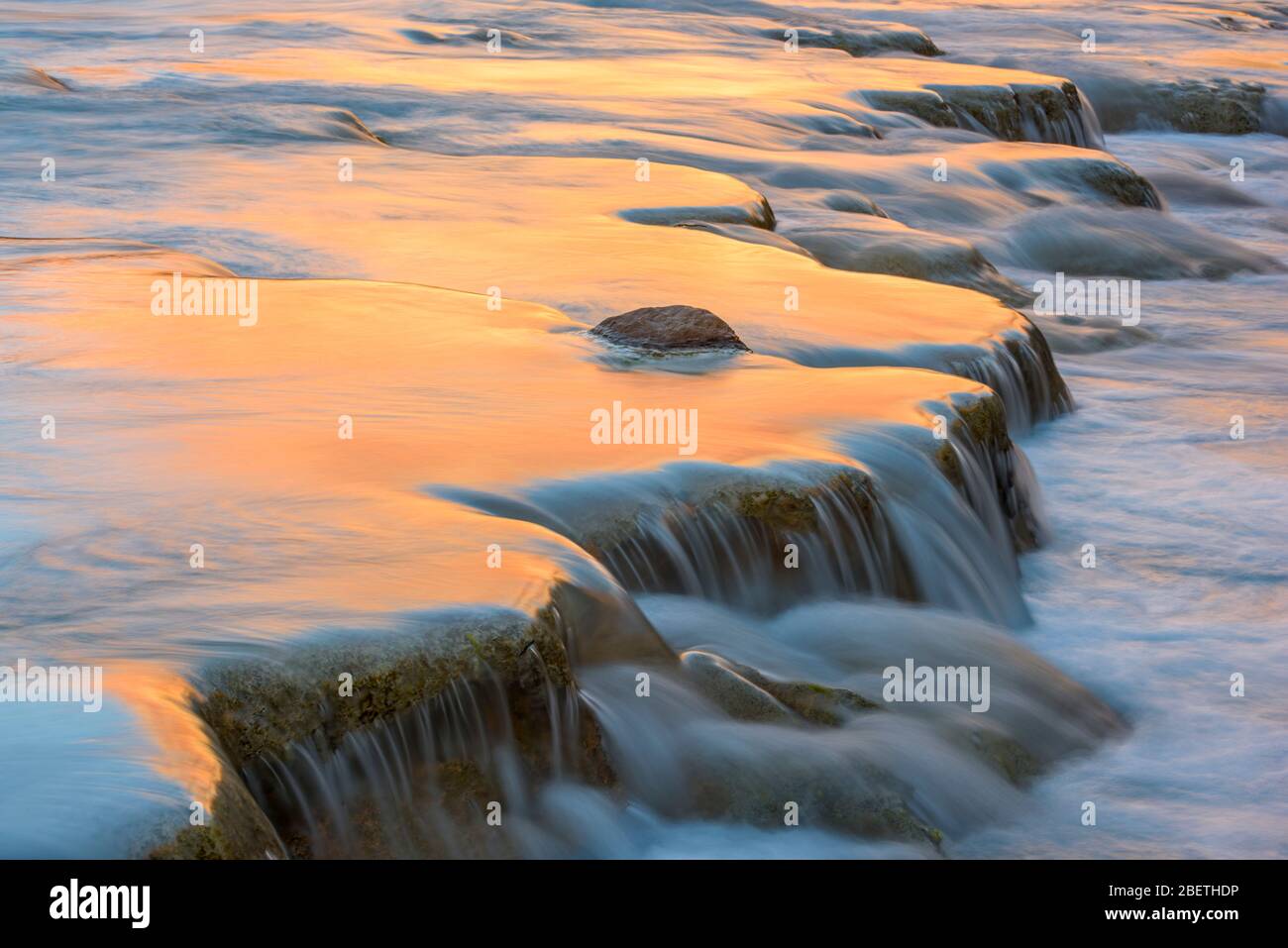 Little Colorado River- mineral-laden water flowing over travertine ...