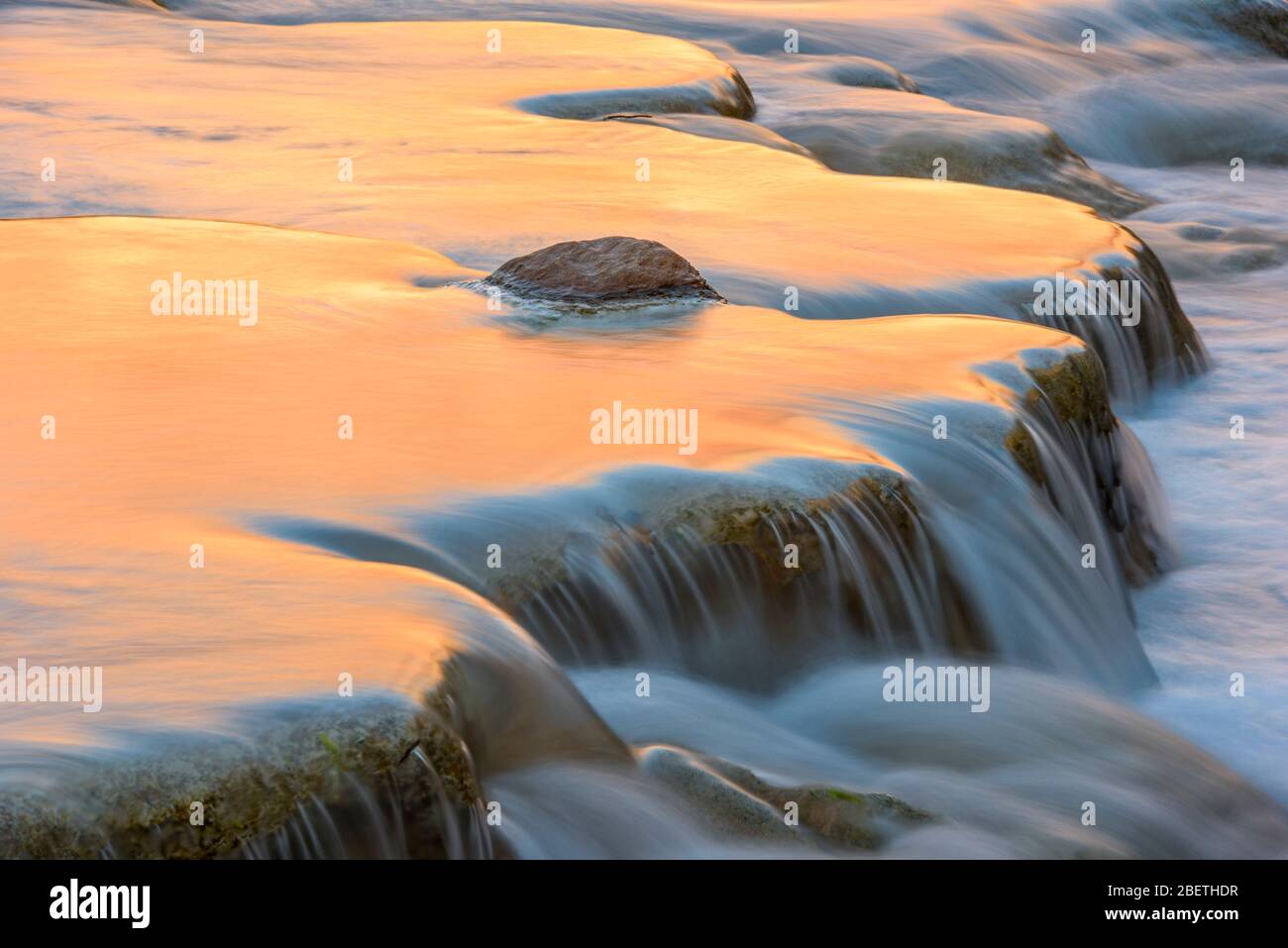 Little Colorado River- mineral-laden water flowing over travertine ...