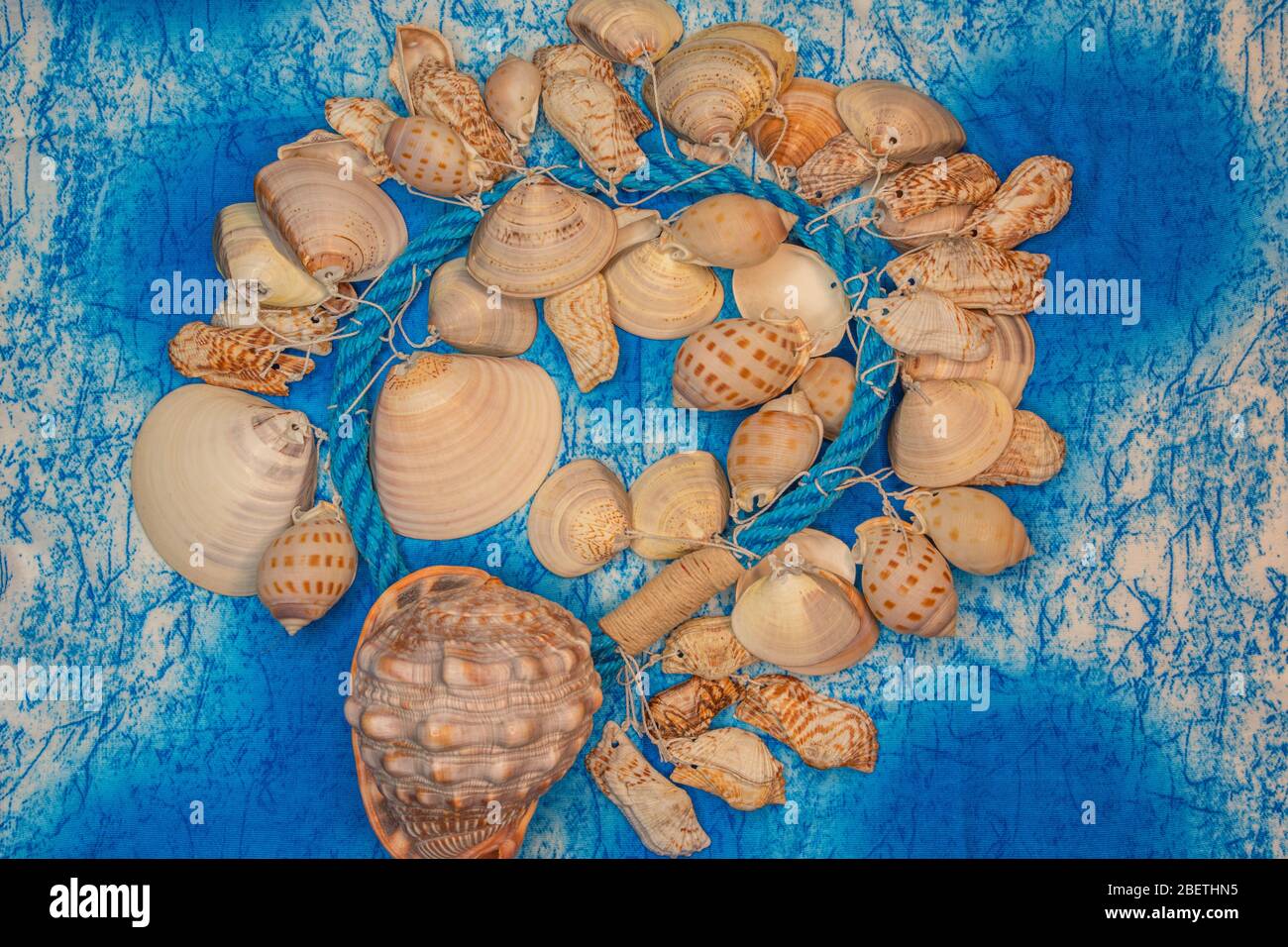 Background of blue cloth with marine shells Stock Photo - Alamy