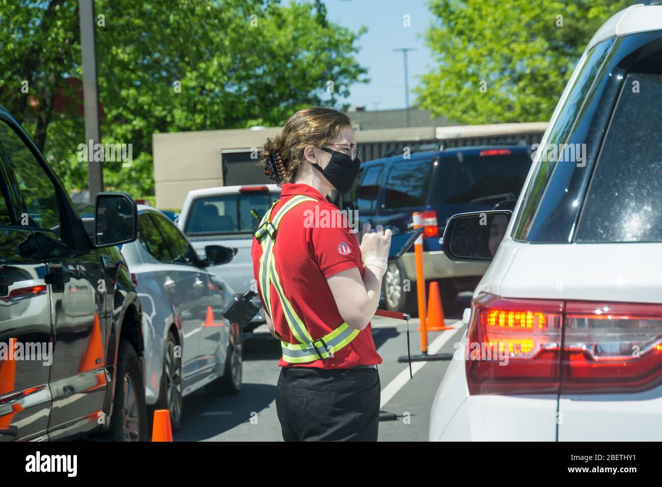 Kennesaw, GA / USA - 04/02/20: Young youthful fast food worker working ...