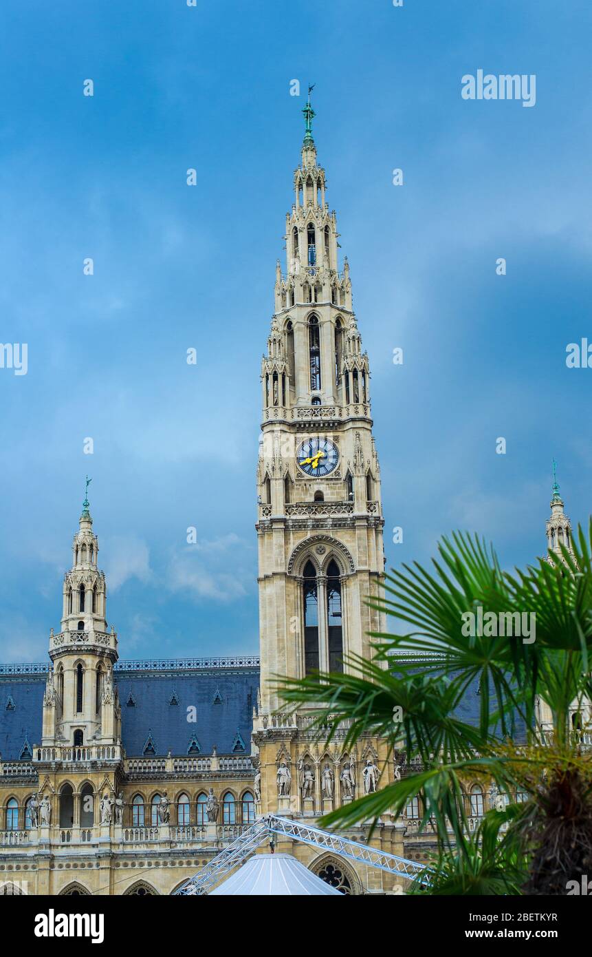 City Hall of Vienna (Rathaus) view through green trees in front of blue ...