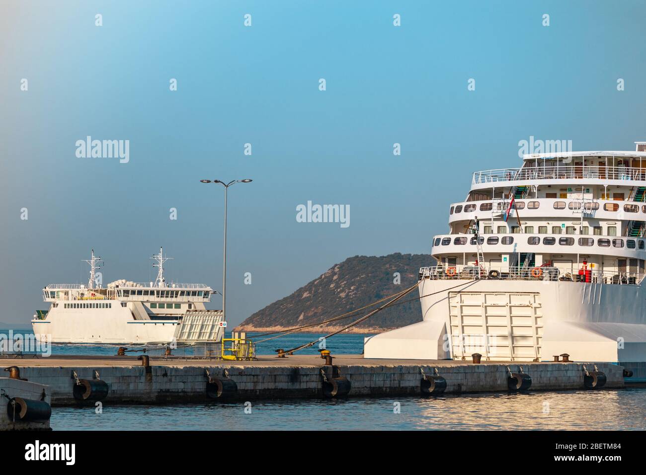 Inter island ferry ship leaving the harbour in the distance with ...