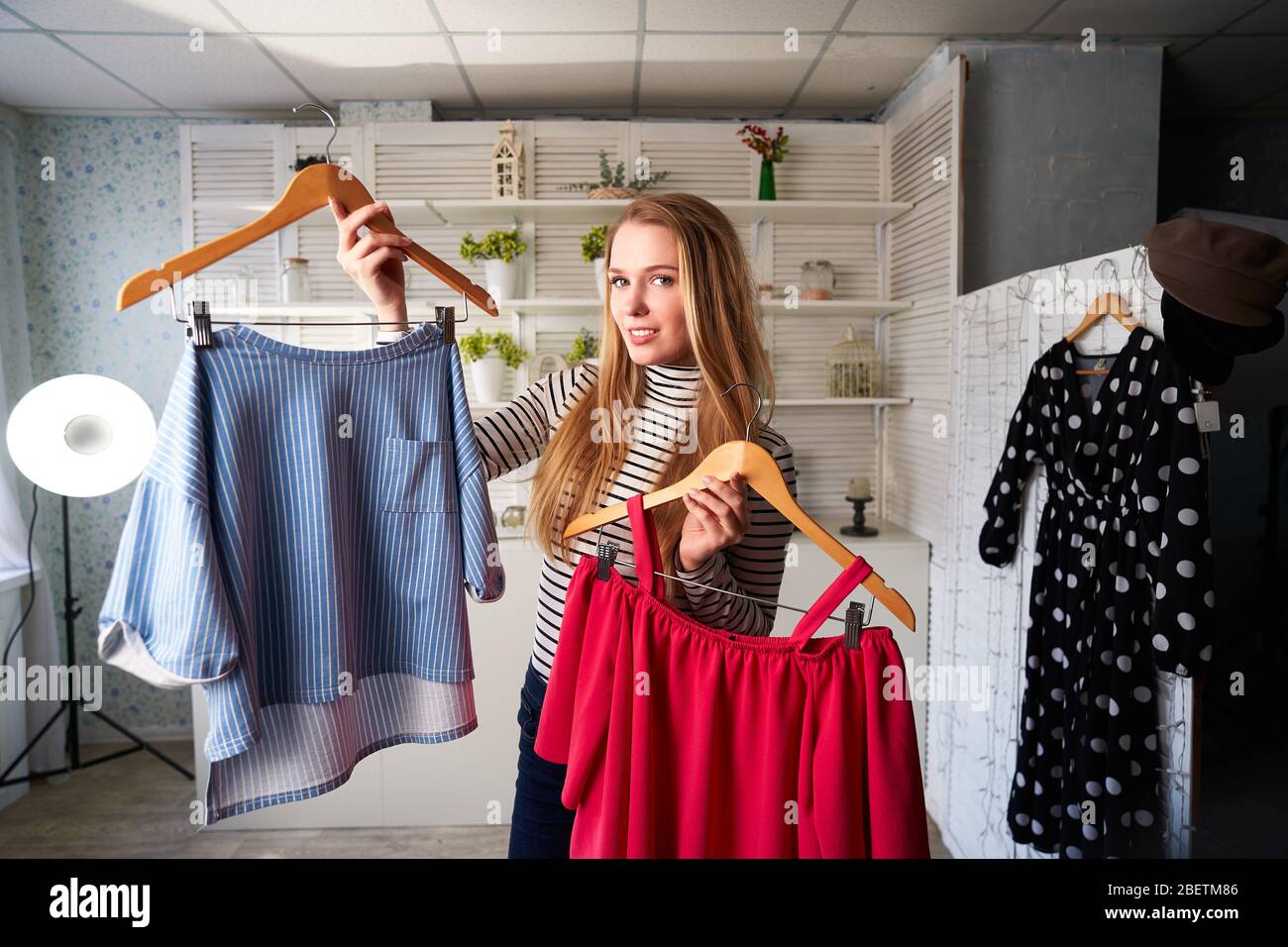 Fashion blogger woman in jeans and turtleneck showing casual colorful ...