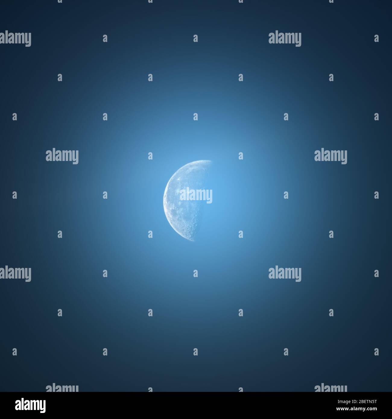 half moon in the blue sky Stock Photo - Alamy