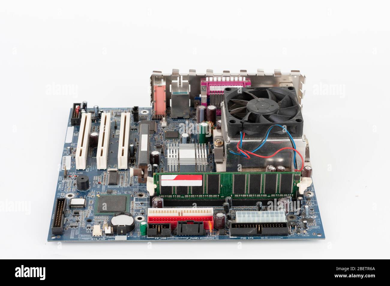 Main board of old desktop computer, CPU cooler fan, memory module in ...