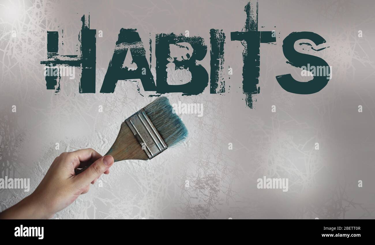 Habits Sign Painted and a hand holding paintbrush on light grey wall ...