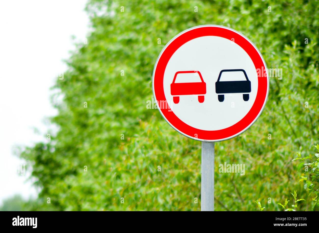 Traffic sign overtaking is forbidden in suburban highway Stock Photo ...
