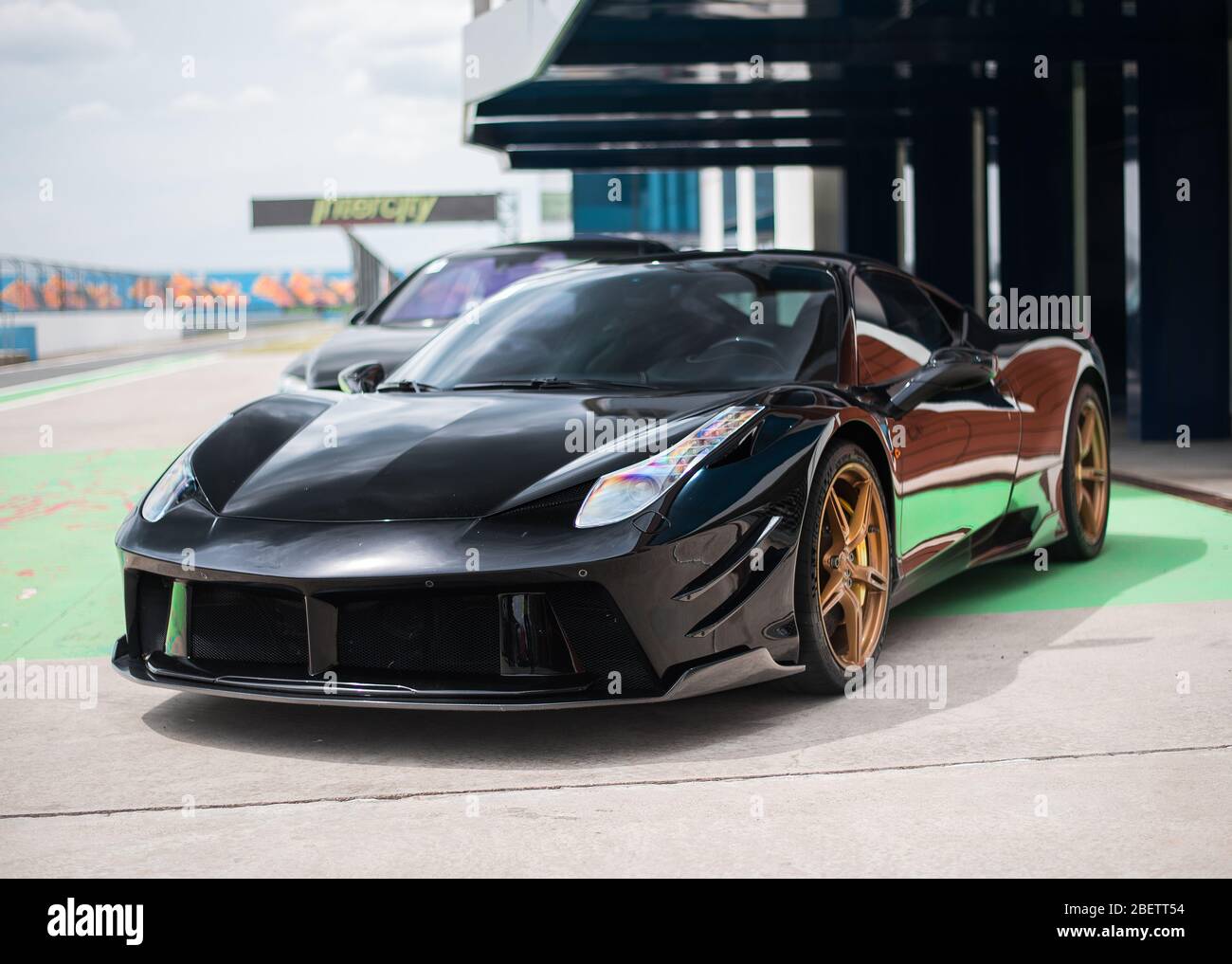 Black sport model car parked in a stadium Stock Photo - Alamy