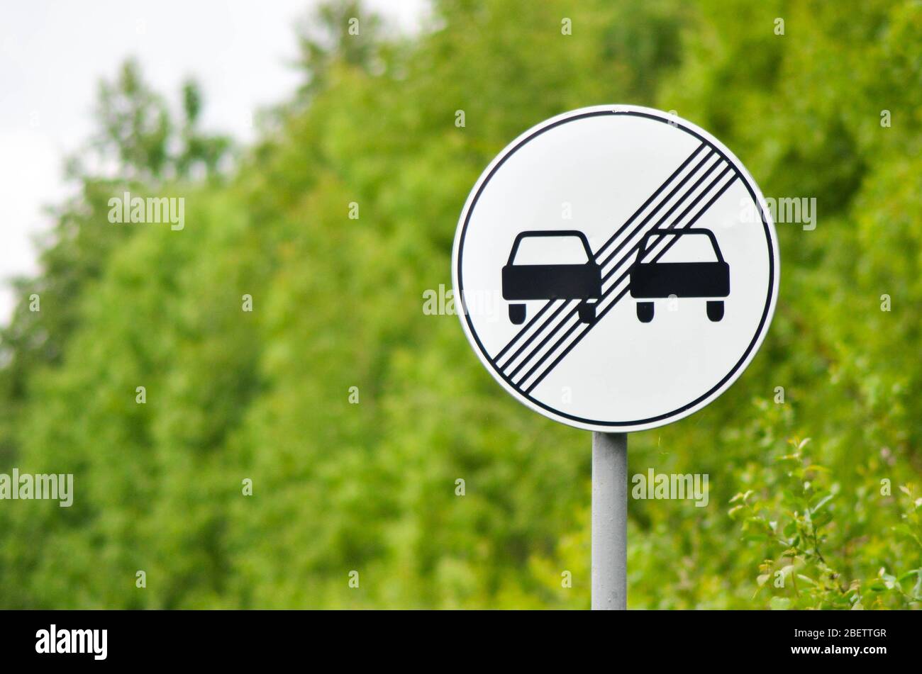 Traffic sign end of prohibition of overtaking in suburban highway Stock ...