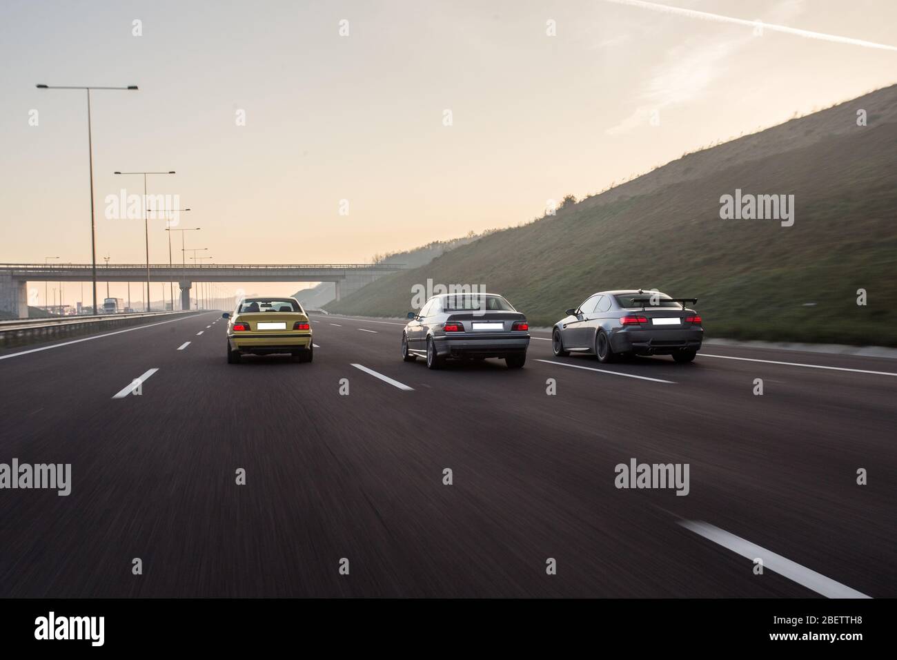 Multiple cars on the highway, view from behind Stock Photo - Alamy