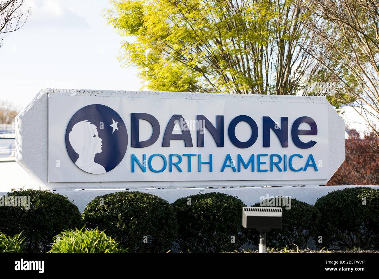 A logo sign outside of a facility occupied by Danone North America in Bridgeton, New Jersey on ...