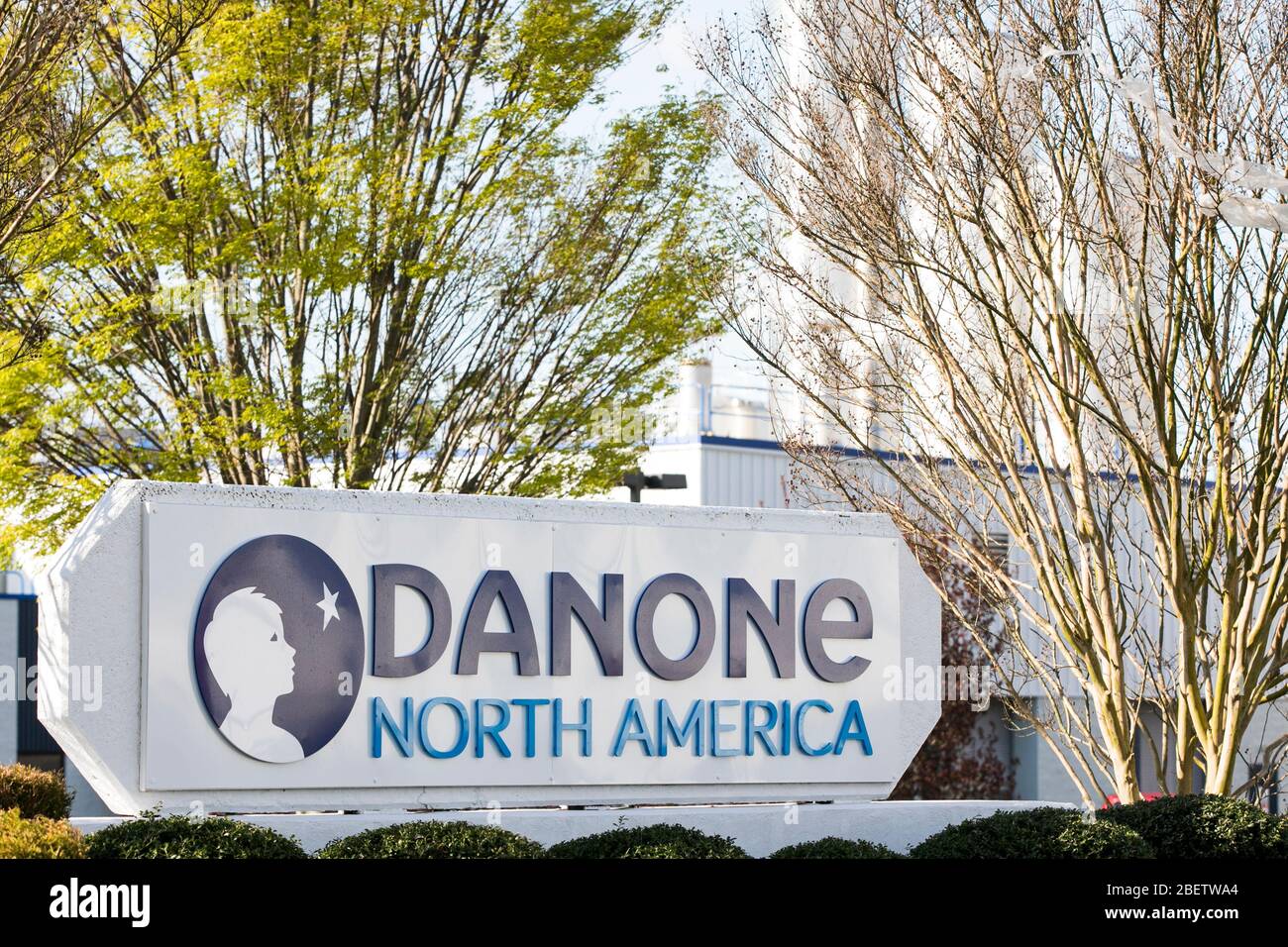 A logo sign outside of a facility occupied by Danone North America in ...