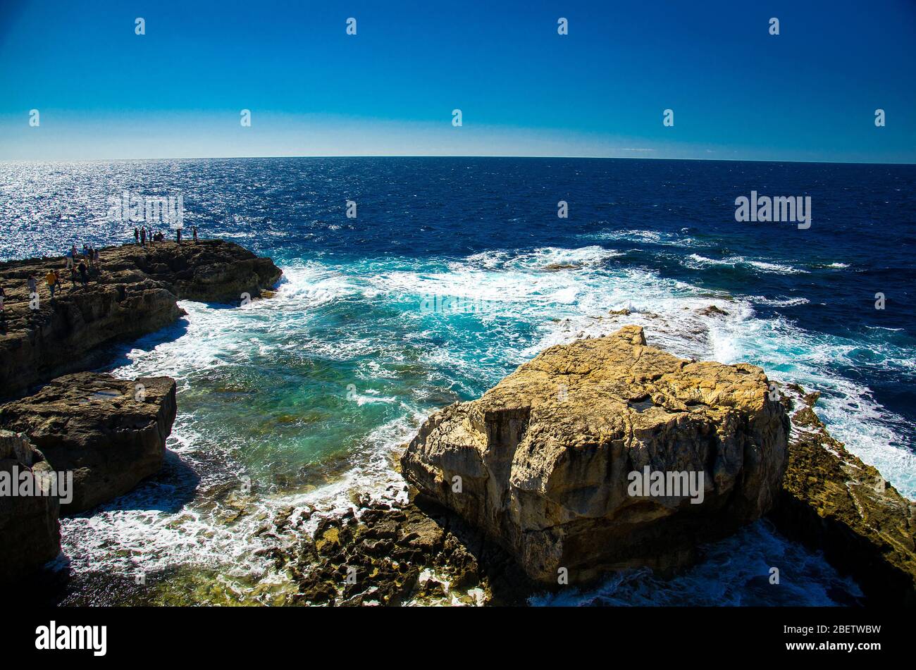 Rocky coastline and sea near collapsed Azure window in Dwejra Bay, Gozo ...