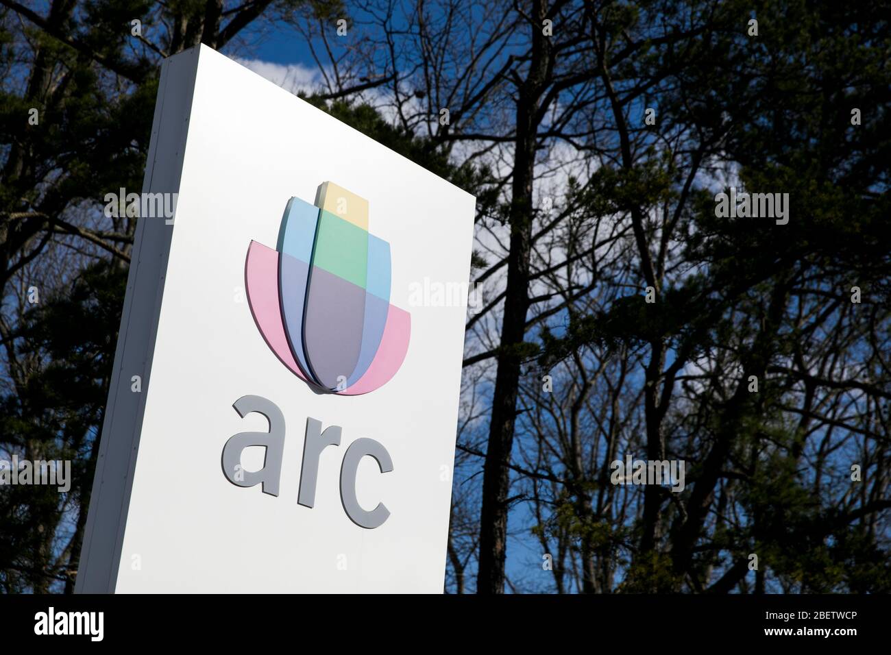 A logo sign outside of a facility occupied by Arc International in ...