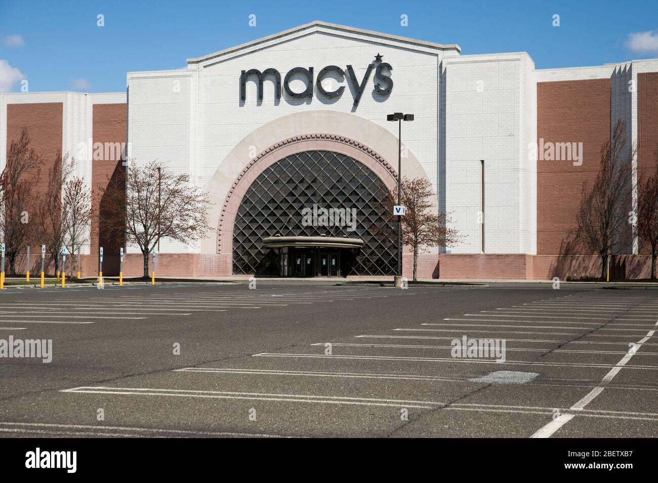 A logo sign outside of a Macy's retail store location in Mays Landing ...
