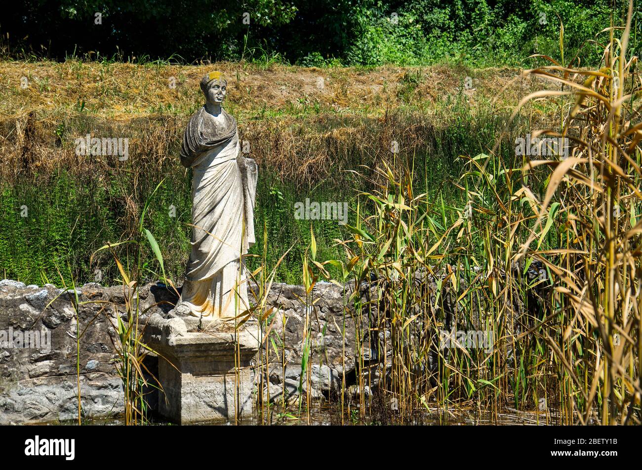 Statue replica monument at ancient ruins of Dion Archeological Site ...