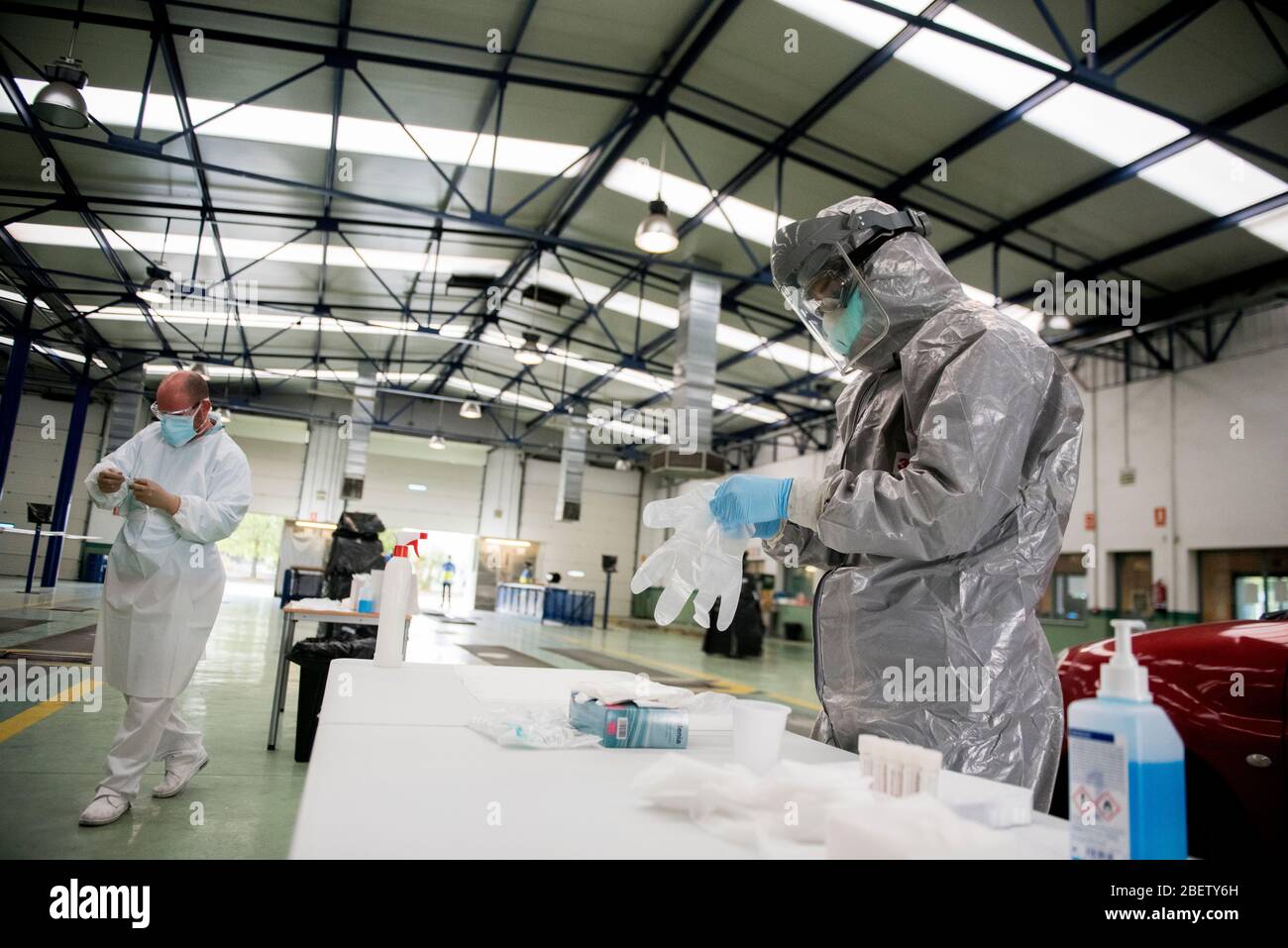 Health workers prepare for a PCR test at a vehicle technical inspection ...