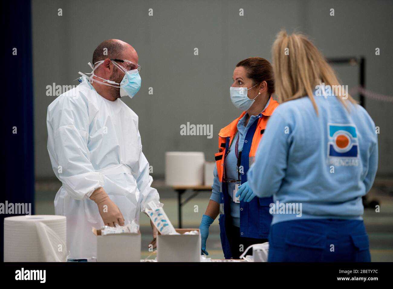 Health workers prepare for a PCR test at a vehicle technical inspection ...