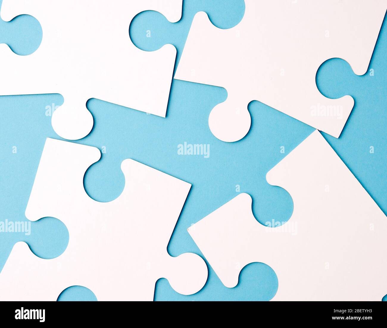 empty white big puzzles on a blue background. Concept in business ...
