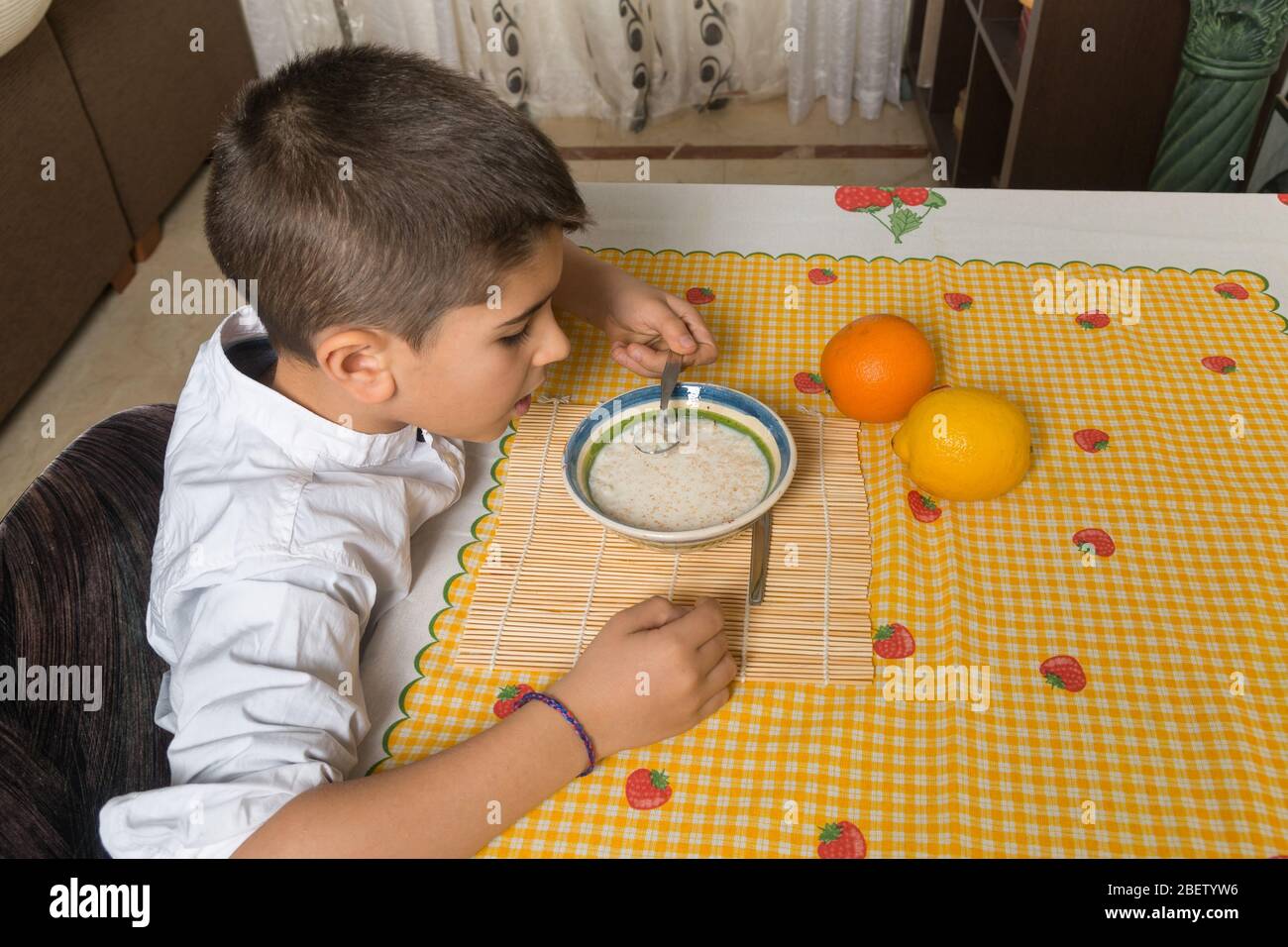 Child eating rice hi-res stock photography and images - Alamy