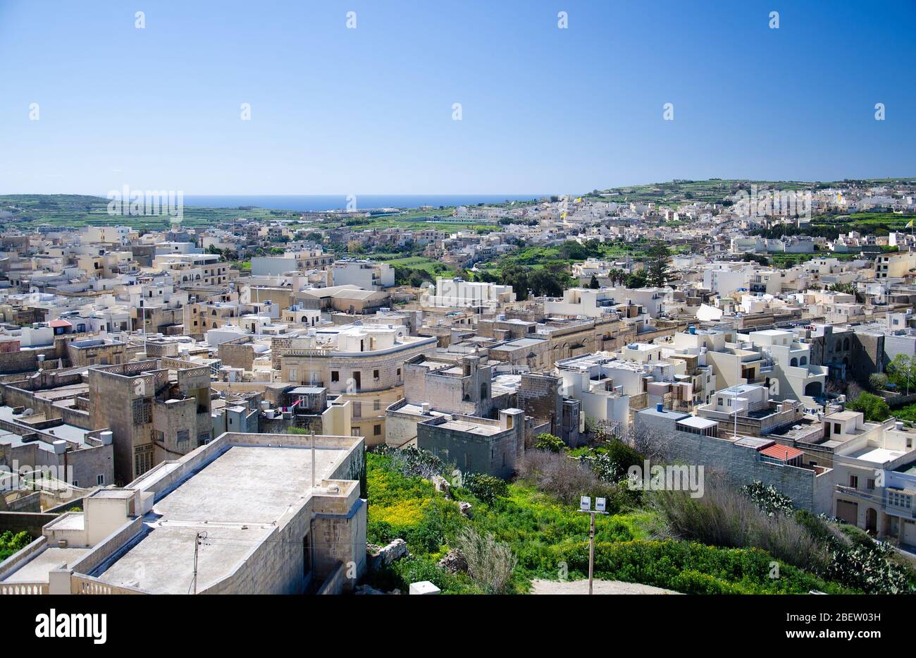 Arial view of white buildings town and green Gozo island and villages ...