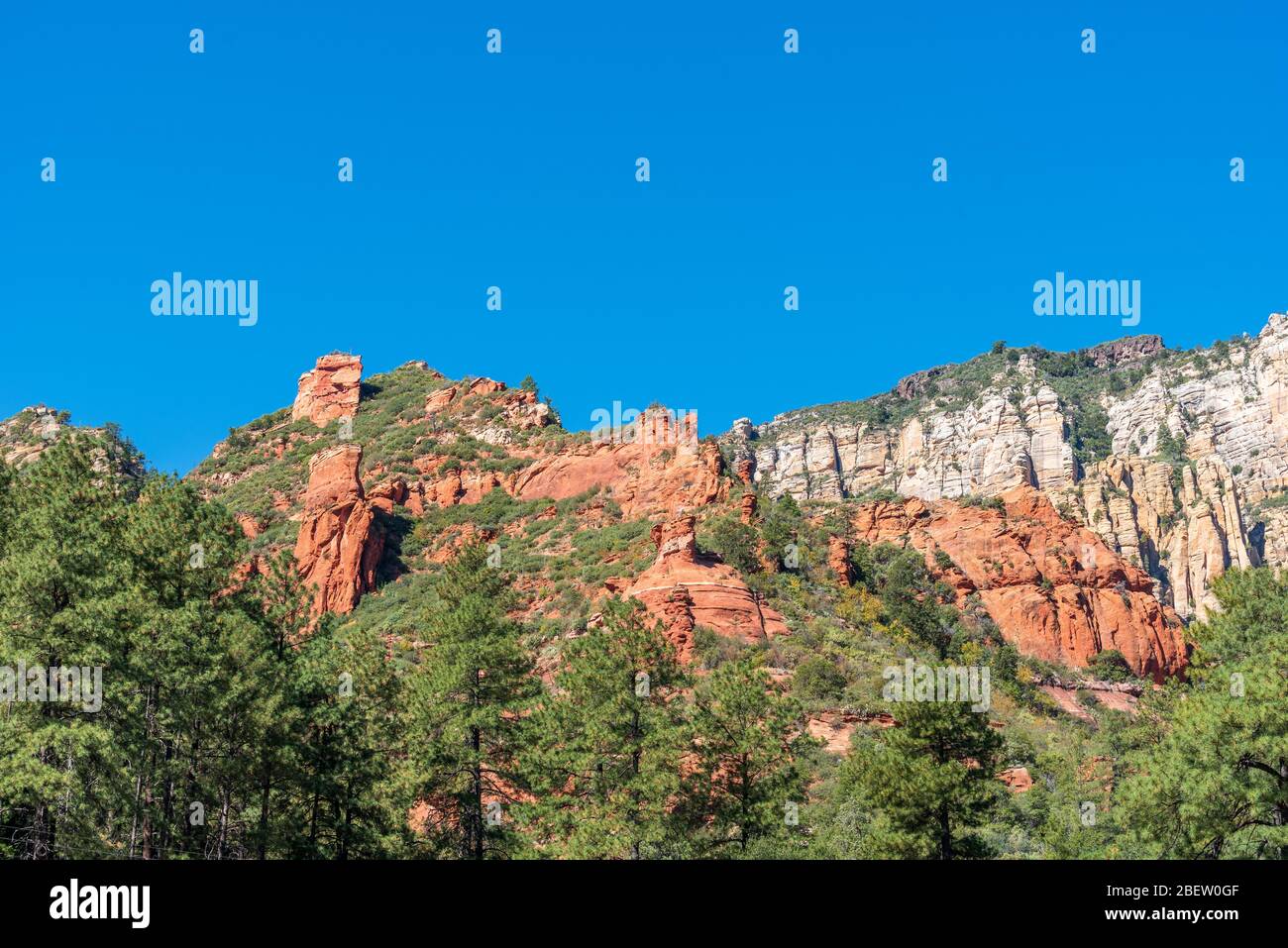 Low angle landscape of jagged colorful hills at Slide Rock State Park ...