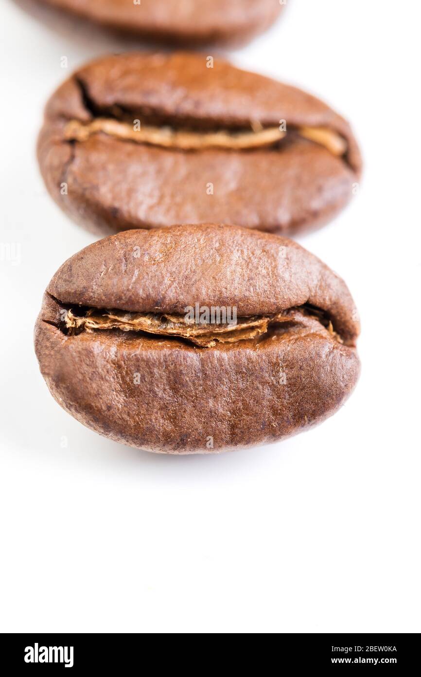 Beautiful fresh roasted coffee beans on a white background Stock Photo ...
