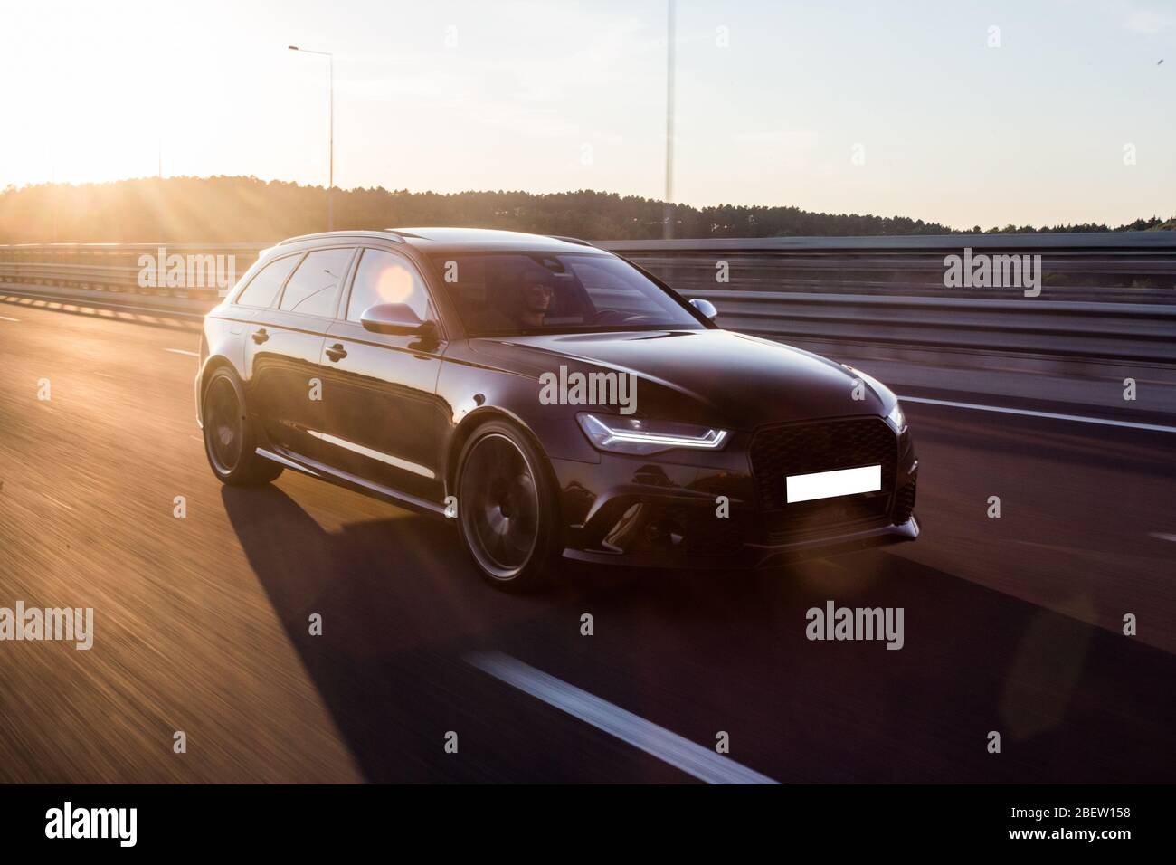 Black car driving hi-res stock photography and images - Alamy