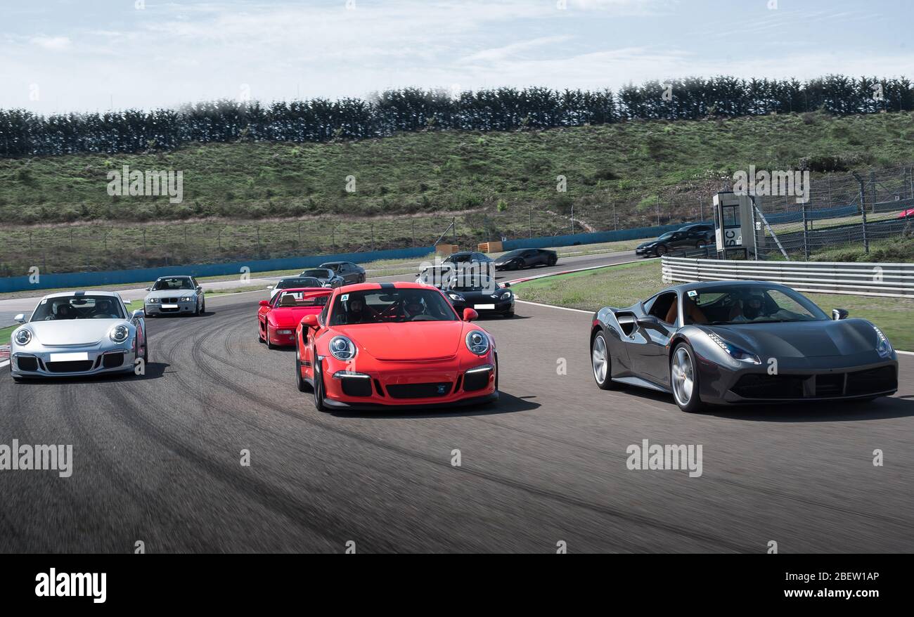 Multiple sport racing cars on the highway Stock Photo - Alamy