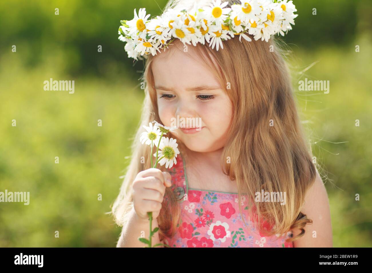 A child with a wreath of flowers Stock Photo - Alamy