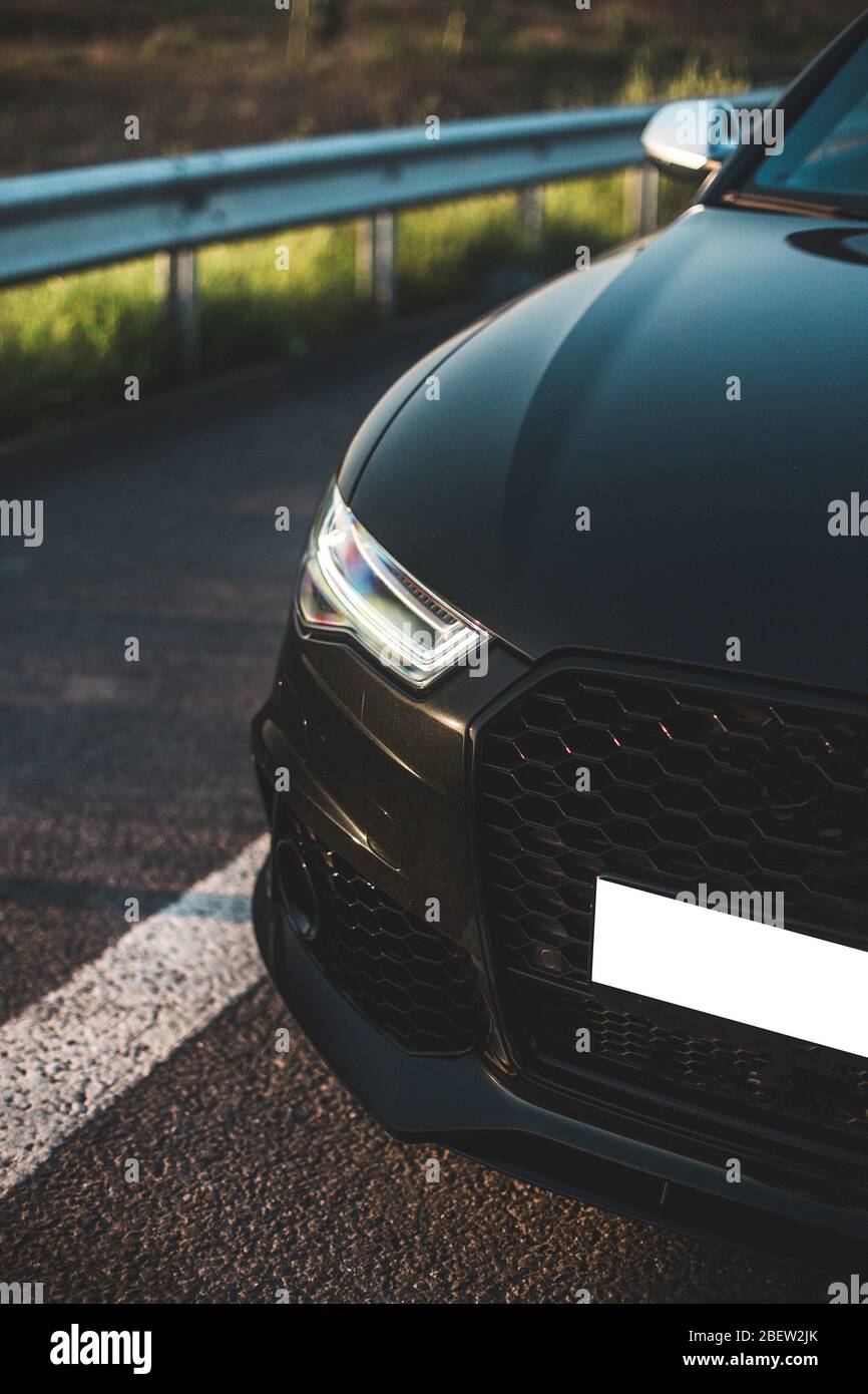 Front design light and bumper of a black car Stock Photo - Alamy