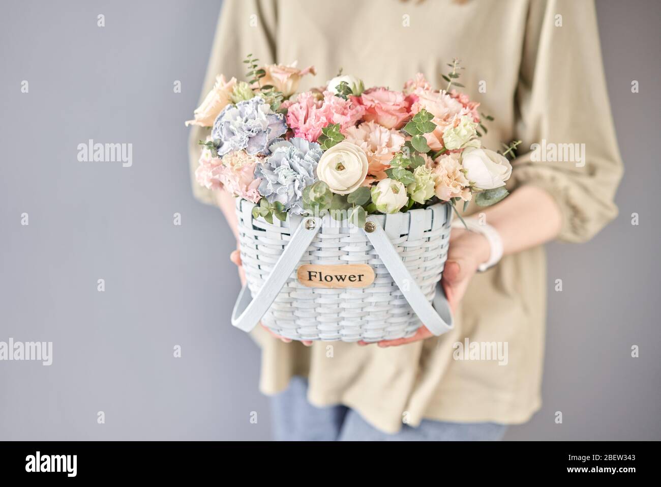 Small flower shop and Flowers delivery. Flower arrangement in Wicker ...