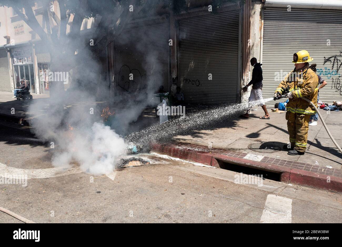 Los Angeles, California, USA. 15th Apr, 2020. A firefighter puts out a ...