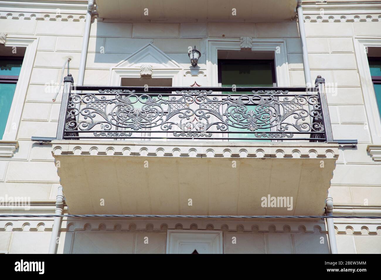 window balcony on a stone building . elegant decorative old stone ...