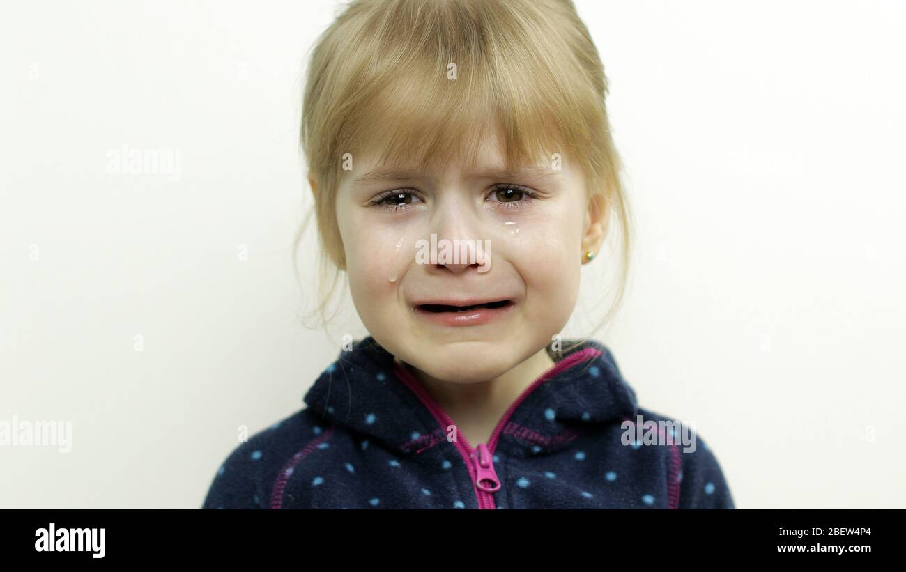Portrait of little toddler girl crying and tears down her face ...