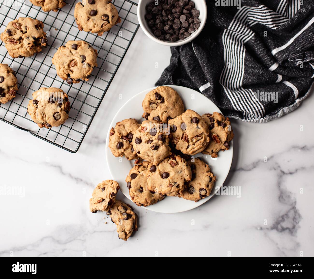 Top view of chocolate chip cookies on a plate on white marble counter ...