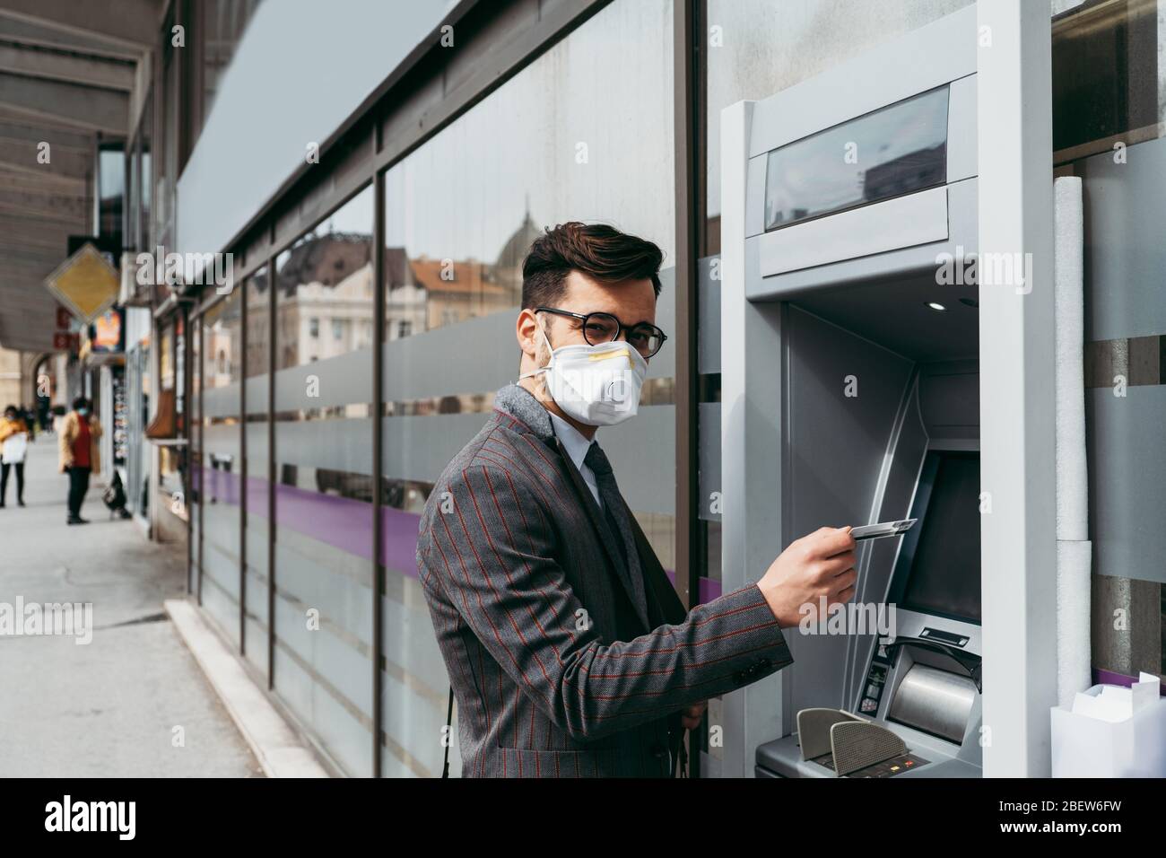 Using an atm machine hi-res stock photography and images - Alamy